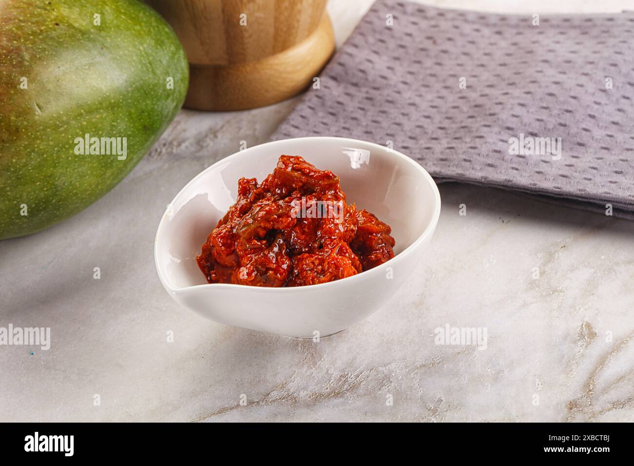 Indian cuisine Spicy pickled raw green mango Stock Photo - Alamy