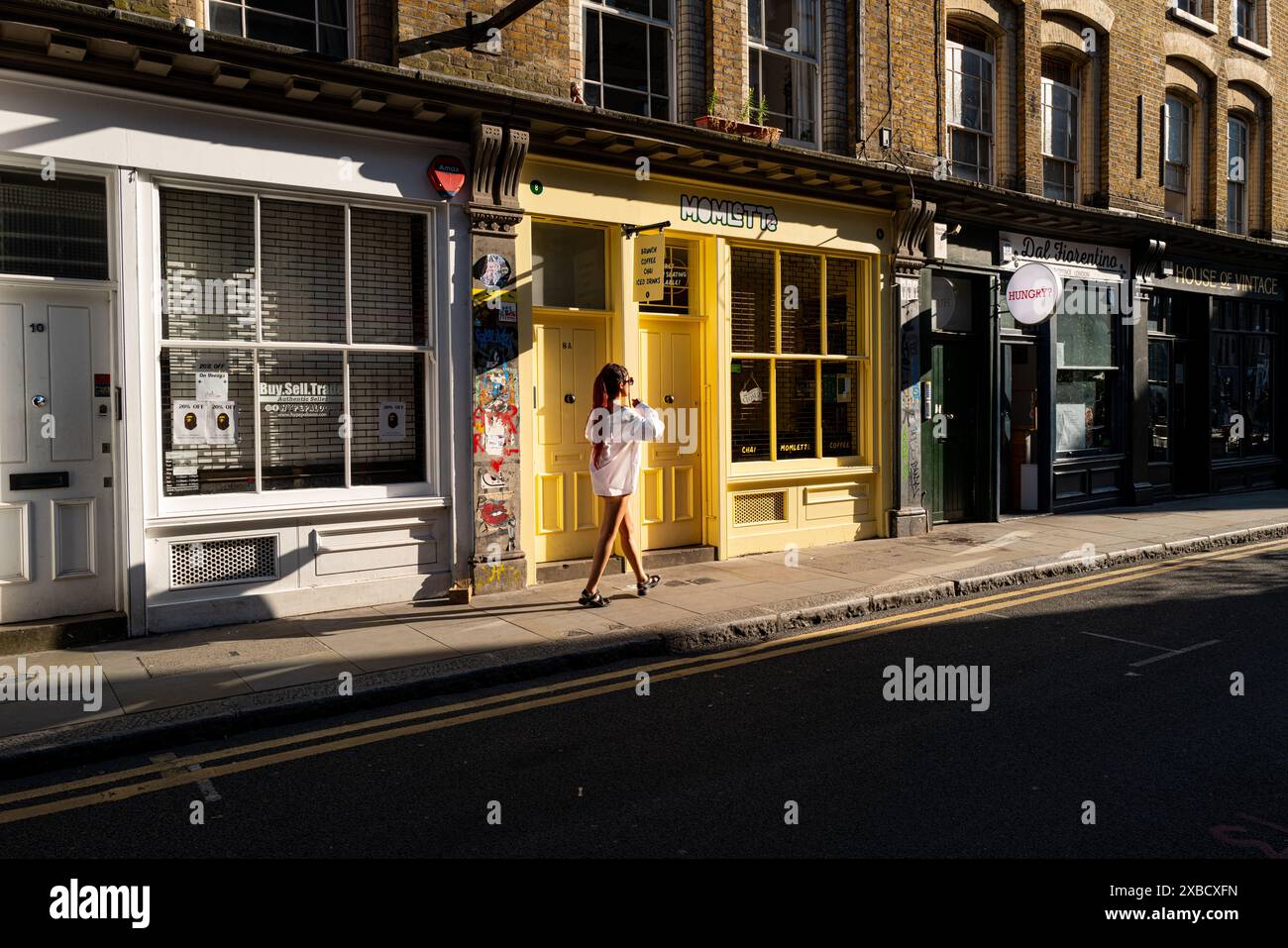 Lone female walking london hi-res stock photography and images - Alamy