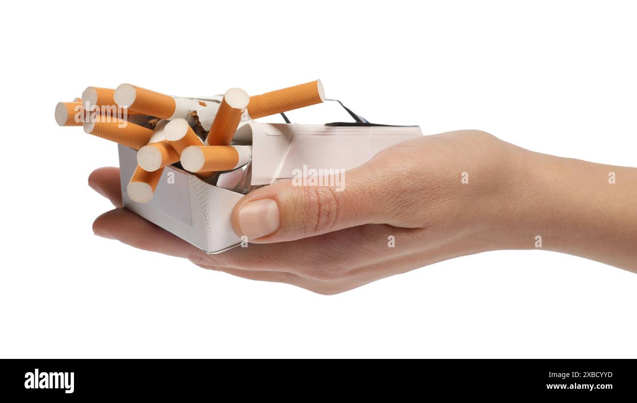 Stop smoking. Man holding pack with cigarettes on white background ...