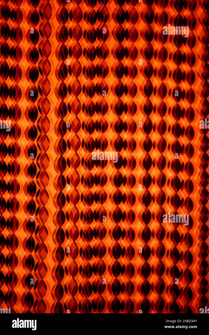 Abstract geometric pattern with intricate shapes in vibrant orange ...