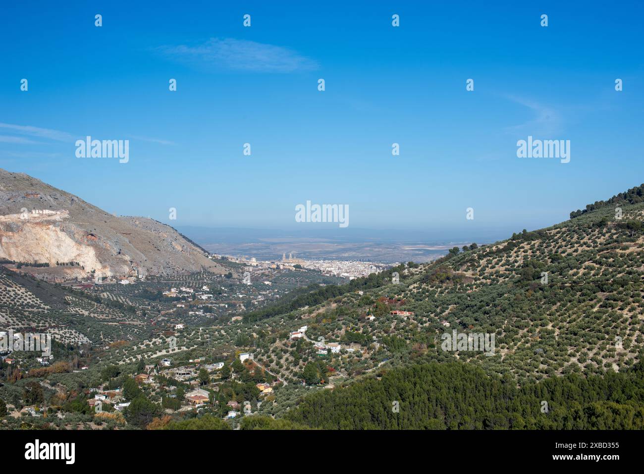 Scenic view of Jaén city nestled among olive groves from the mountains ...