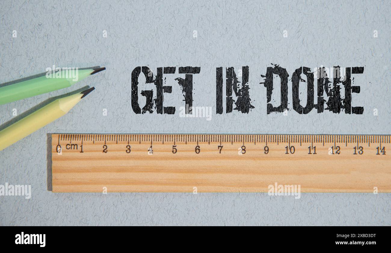 text Get in done - Business handwriting with clock Stock Photo - Alamy