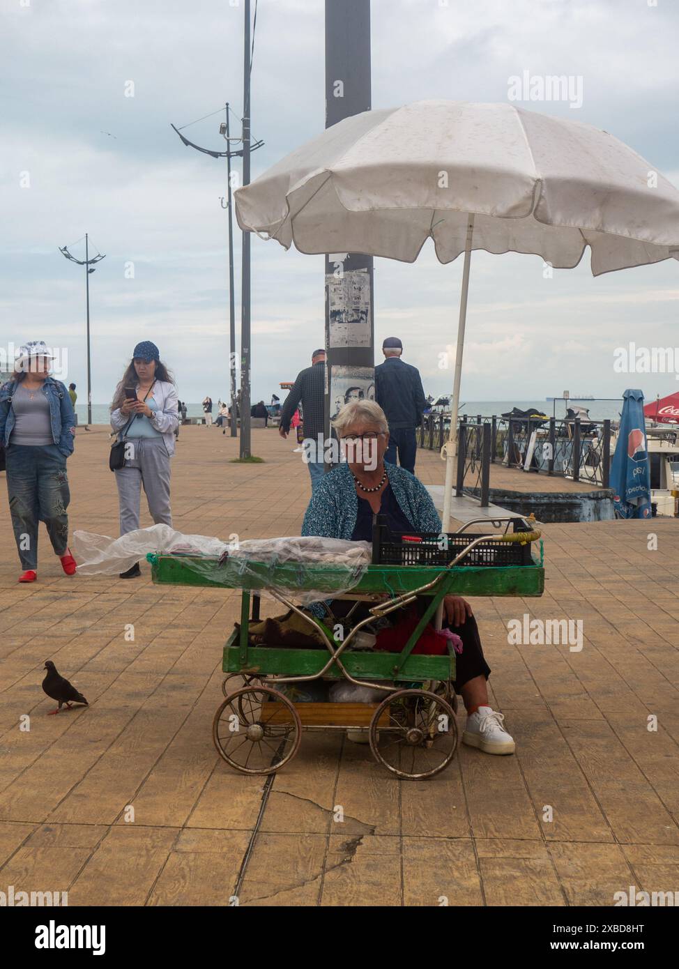 Batumi, Georgia. 05.36.2024 Poor local population. seller from local ...