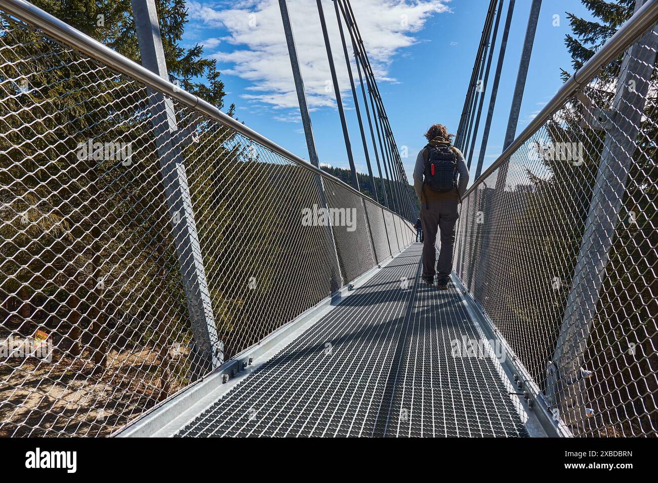 Skybridge 721 suspension footbridge, man walking through Stock Photo ...