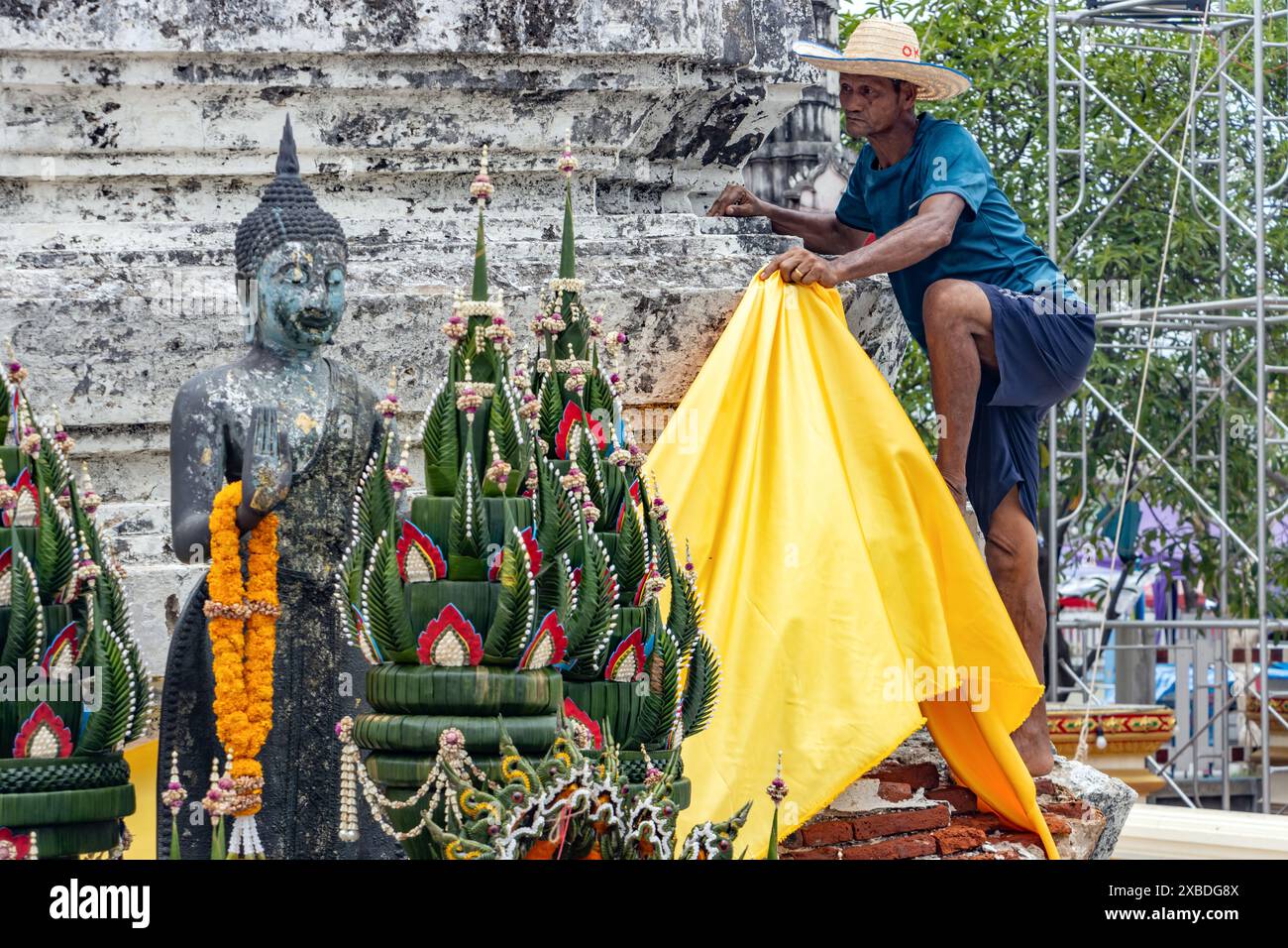 SAMUT PRAKAN, THAILAND, MAY 25 2024, A man decorate a stupa at Wat ...
