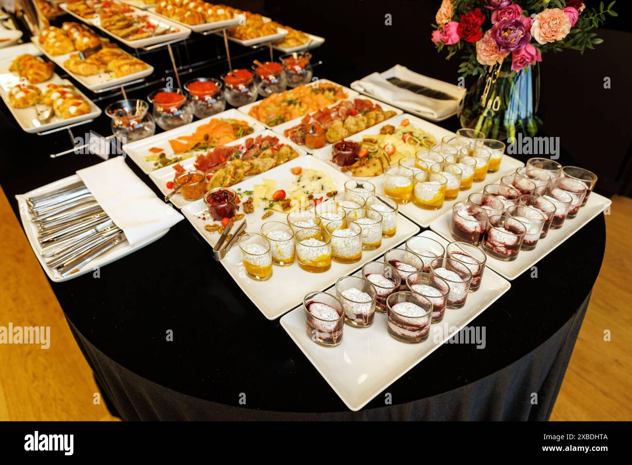 A gourmet presentation of assorted appetizers, canape and chia pudding ...