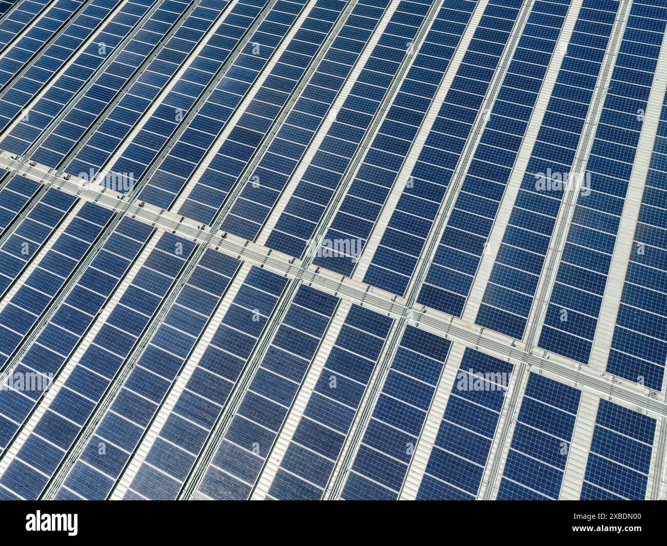 Solar panels on roof of industrial plant. Solar energy for factory or ...