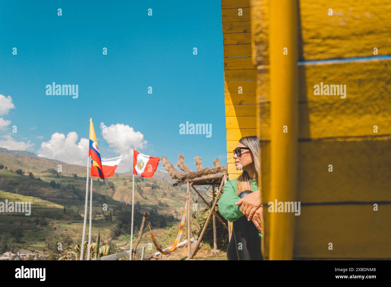 Girl in viewpoint yellow circle, traveling through the peruvian andes ...