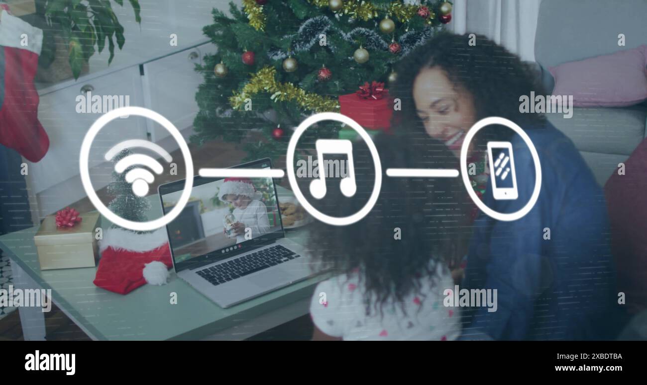 Image of computer icons in digital circles over mother and daughter ...