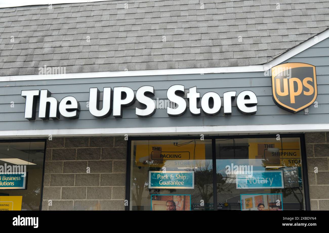 A UPS Store sign is seen in the Hicksville neighborhood in Long Island ...
