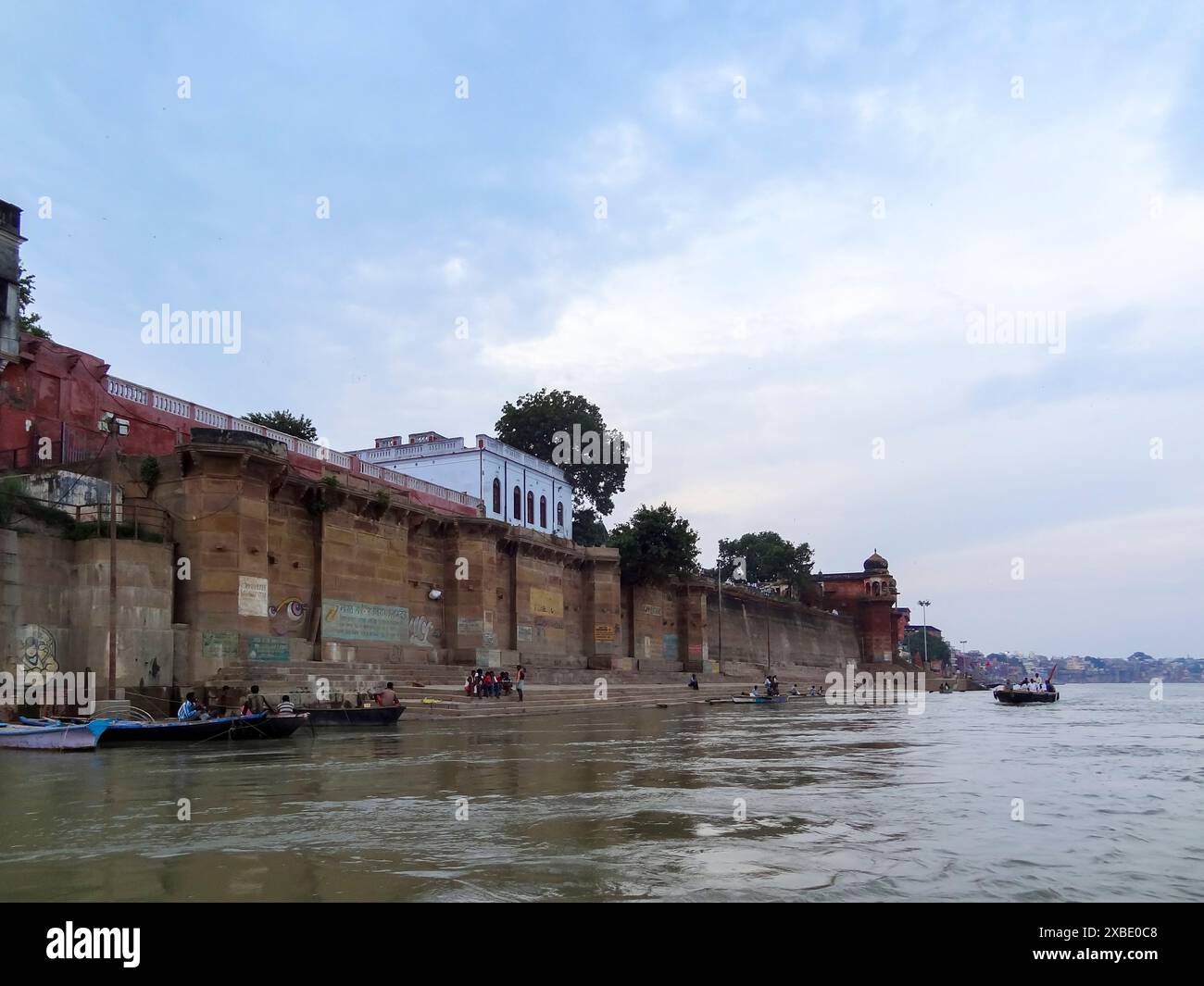 Boats, gats and people at the Ganges riverside at Varanasi, India Stock ...
