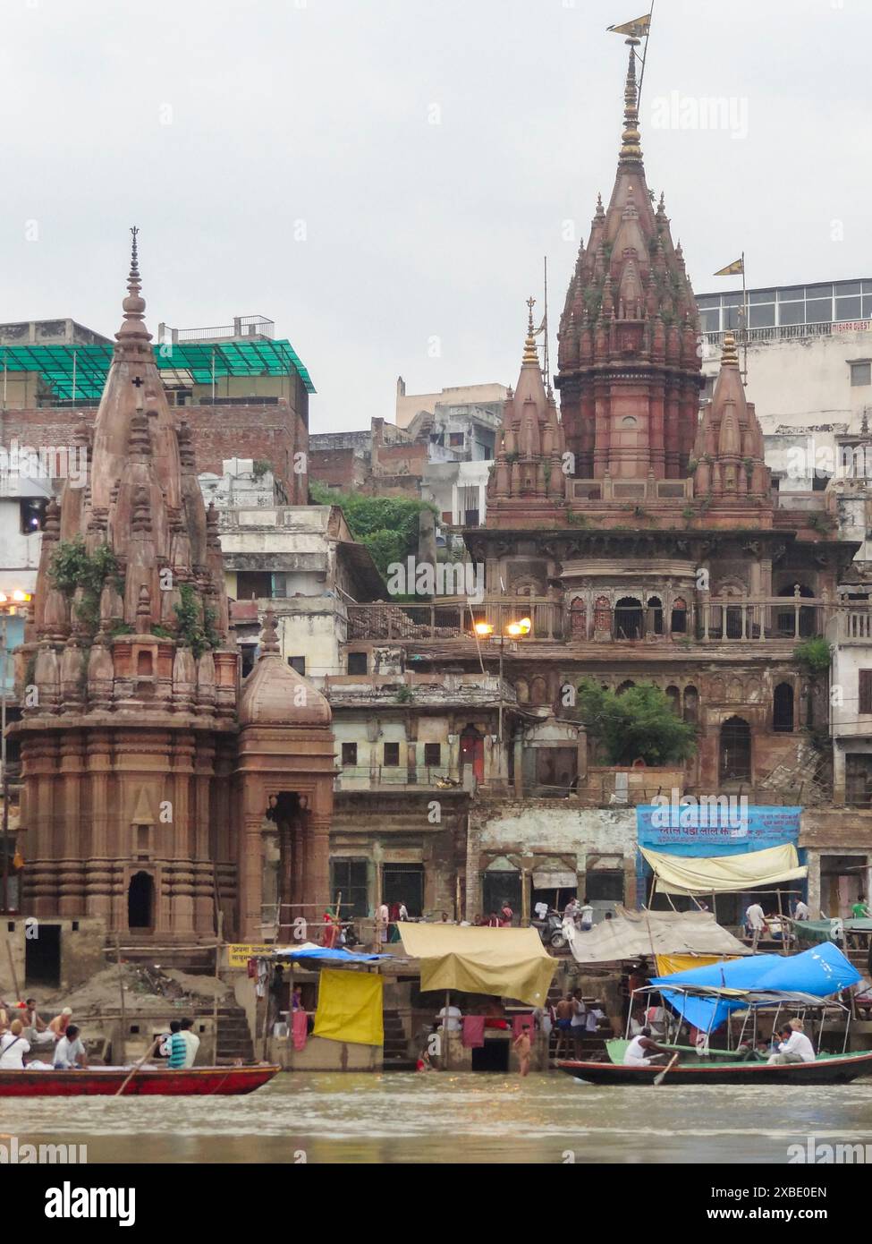 Boats, gats and people at the Ganges riverside at Varanasi, India Stock ...