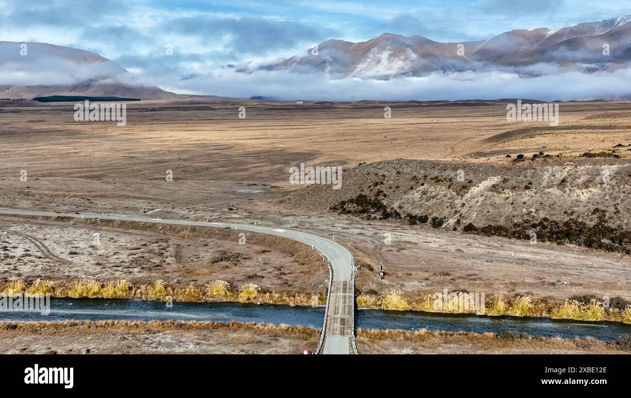 Drone view of the Ashburton highlands with a river flowing through the ...