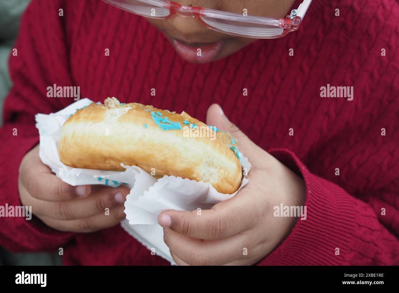 child mouth eating chocolate donuts Stock Photo - Alamy