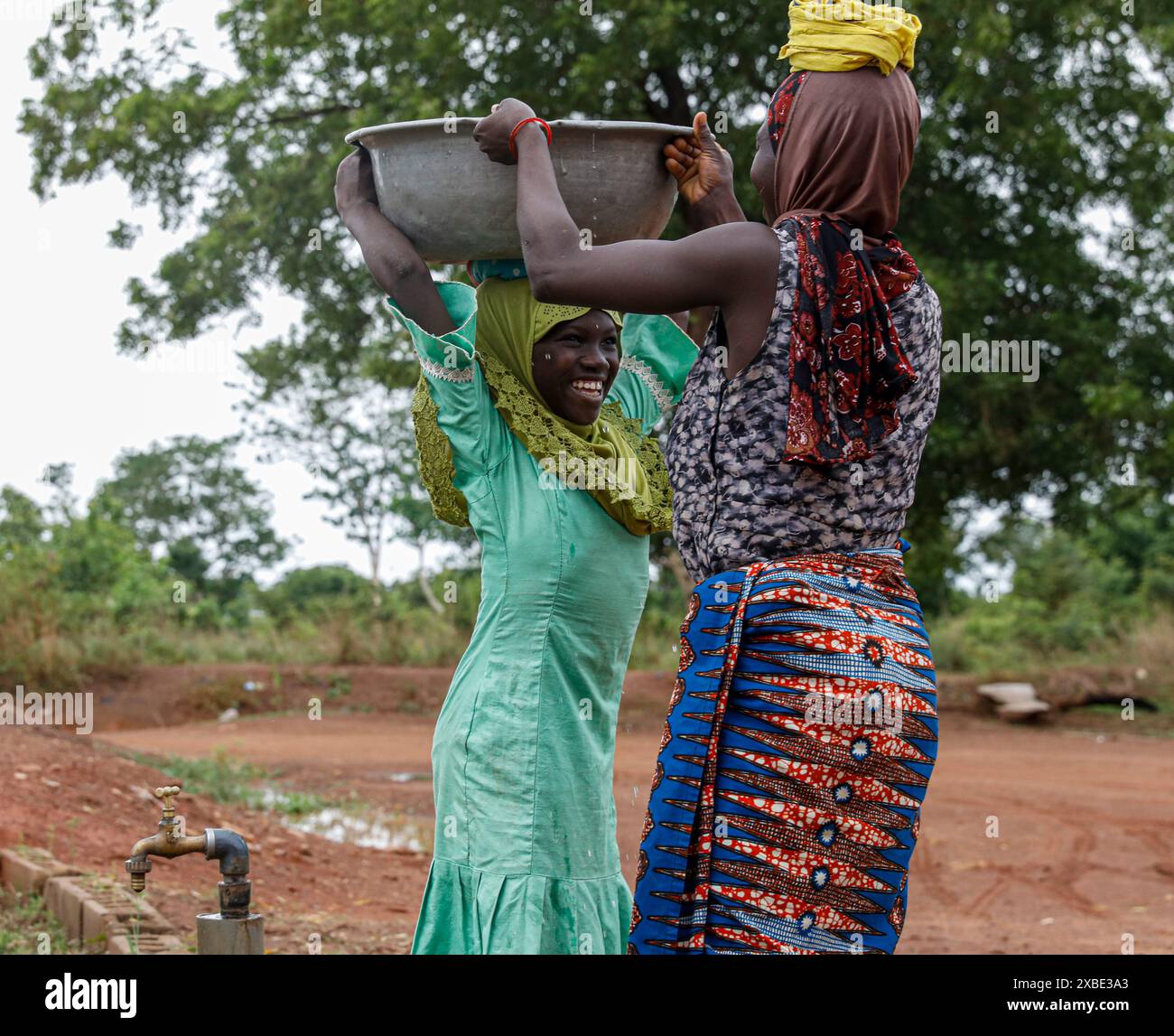 Parakou, Benin. 25th May, 2024. Villagers fetch water from a water ...