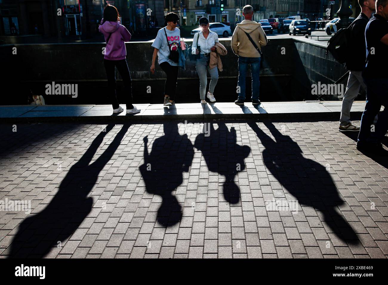 St. Petersburg, Russia. 11th June, 2024. Silhouettes on street ground ...