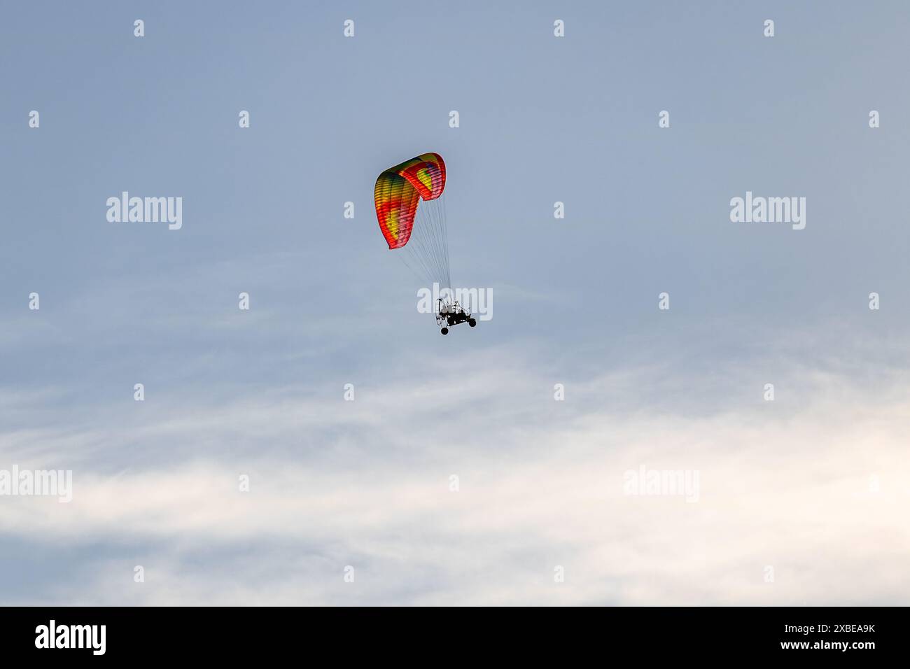 powered paraglider flying in the sky, summer adventure Stock Photo - Alamy