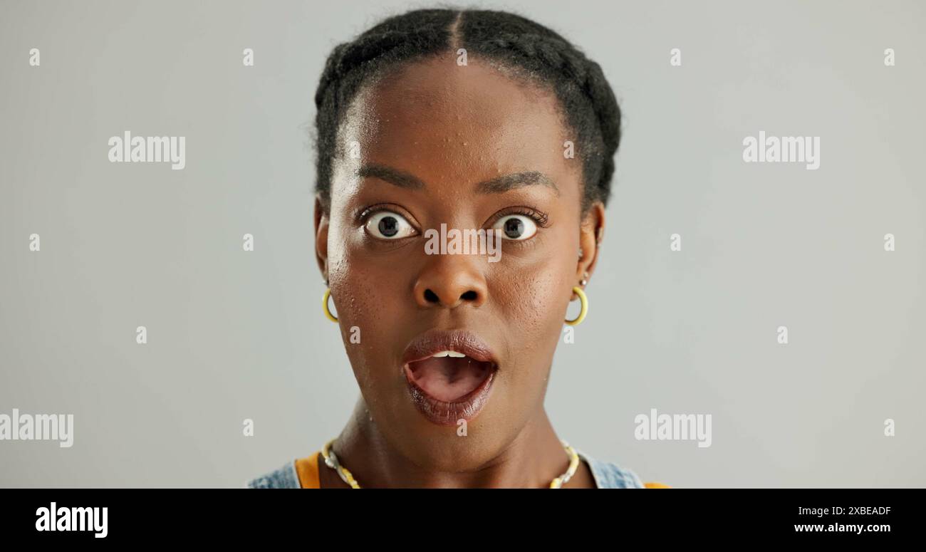 Portrait, surprised and black woman in studio with omg for announcement ...
