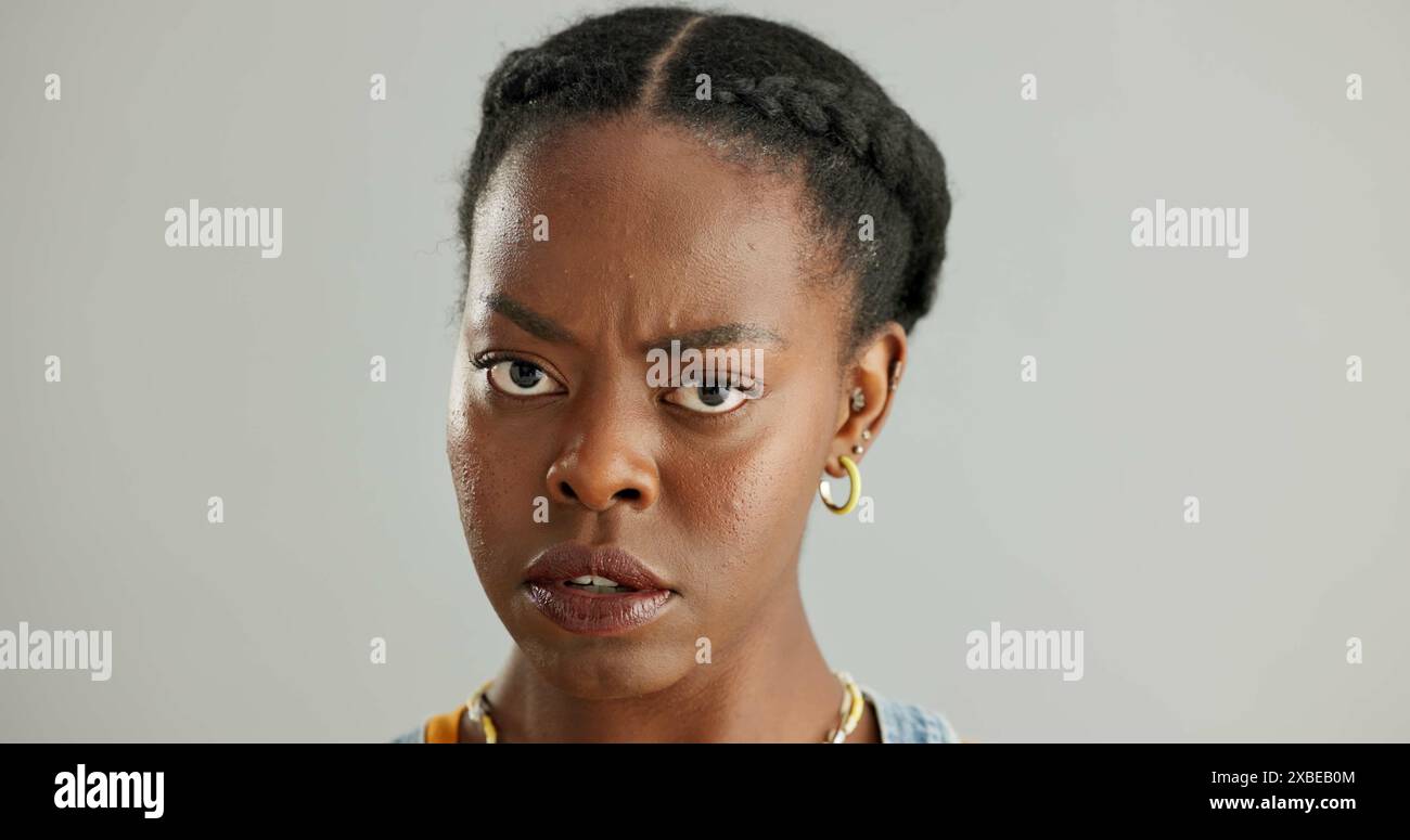 Confused, portrait and black woman in studio with bad news for unsure ...