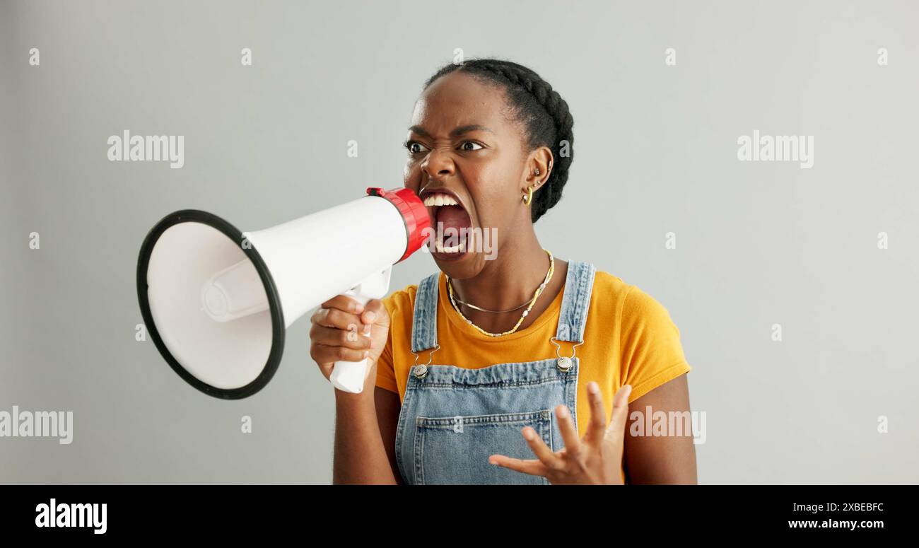 African woman, bullhorn and protest in studio with shouting, anger and ...