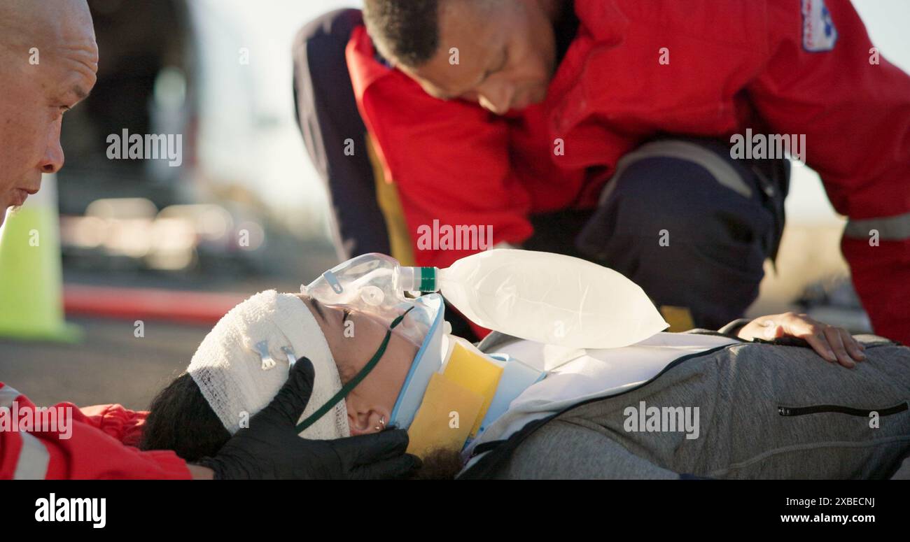 Paramedic, oxygen and outdoor with patient, helping and rescue of ...