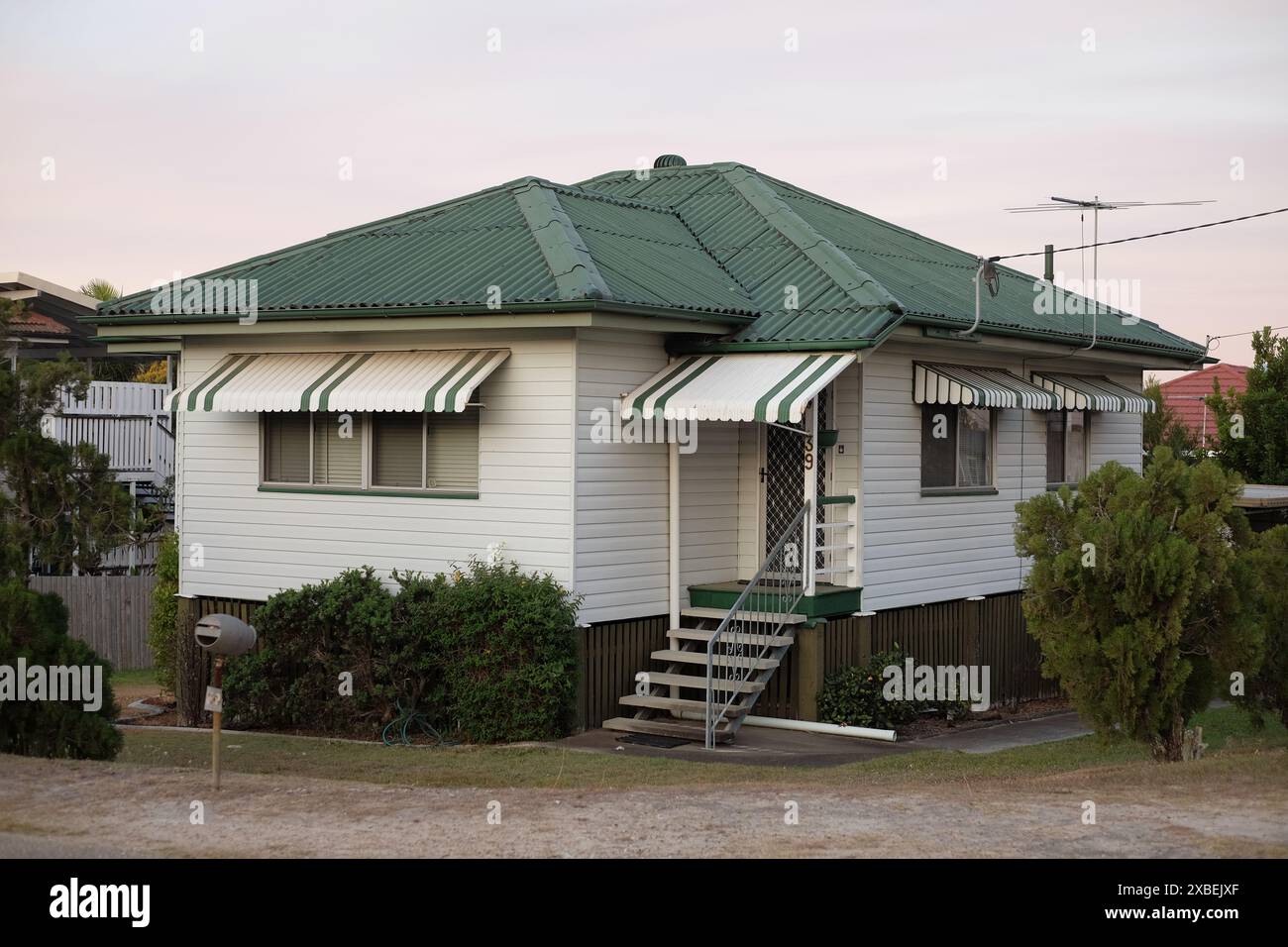 Suburban post war weatherboard house with updated with aluminium ...