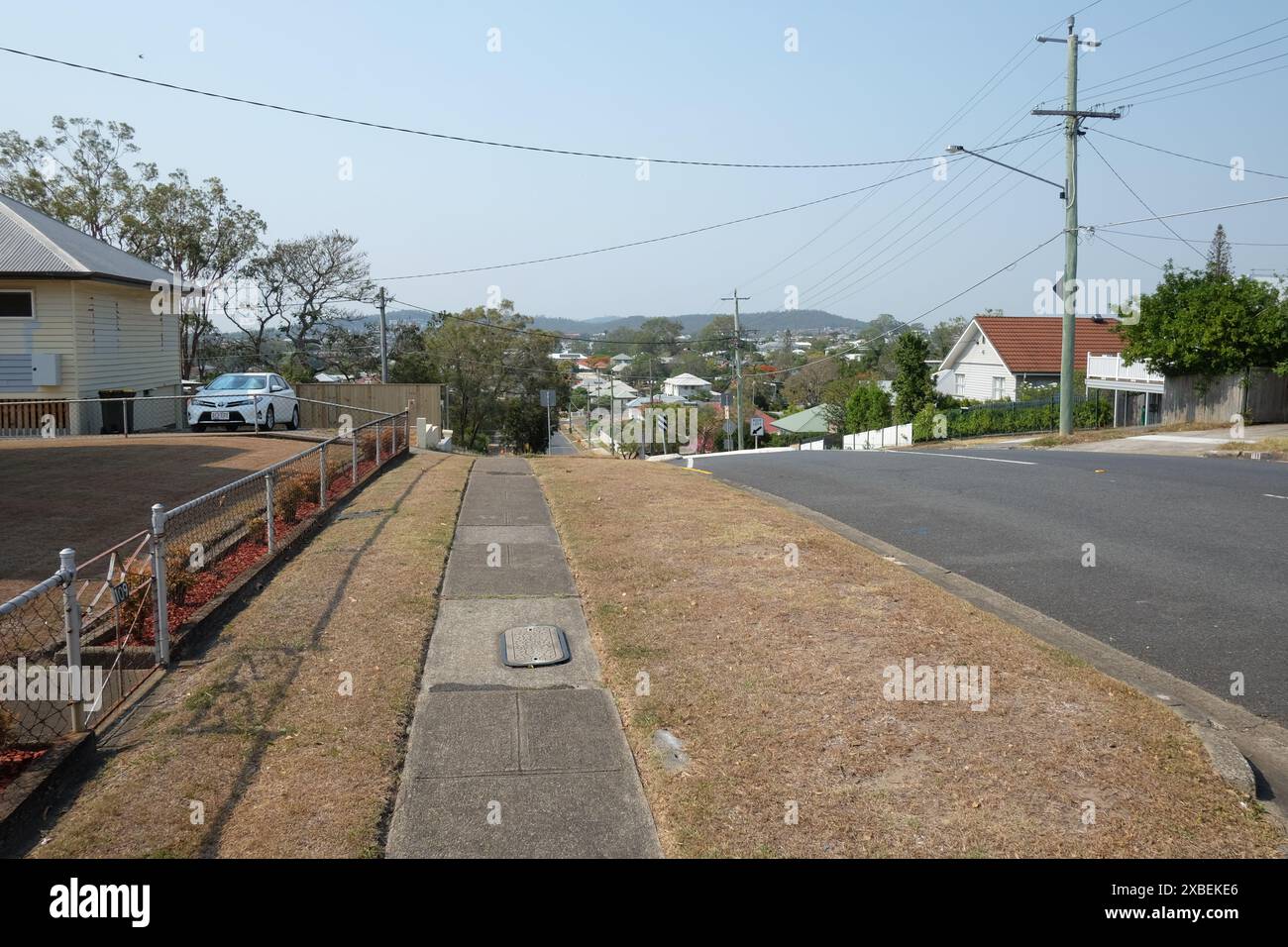Brown grass on the pavement and front yard of a houses on Florence ...