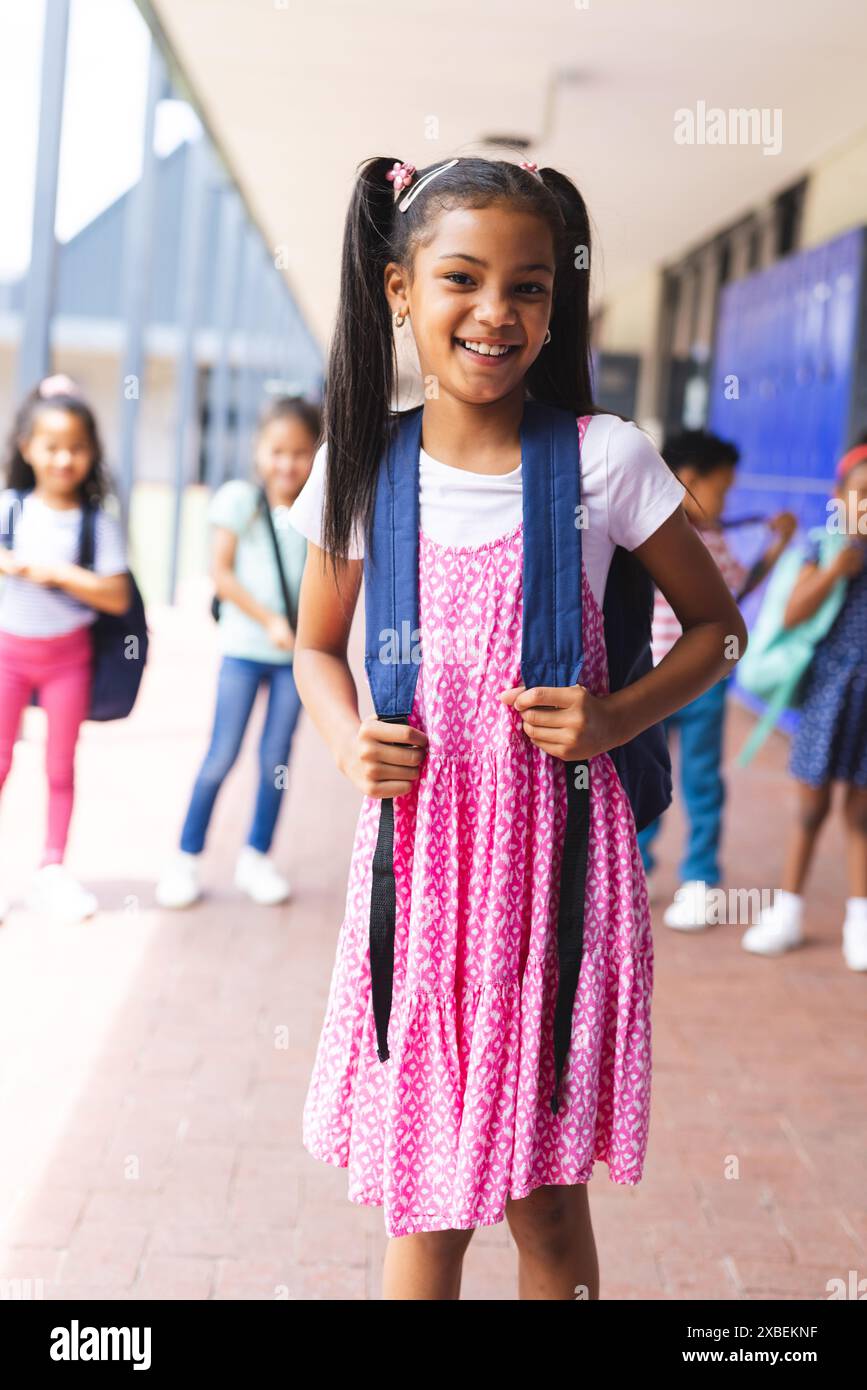Students, including biracial and African American children, smiling ...
