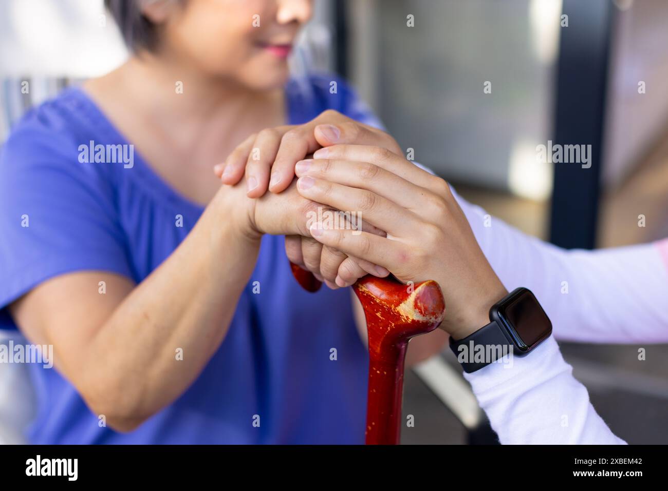 nurse healthcare worker holding hands with senior Asian woman using ...