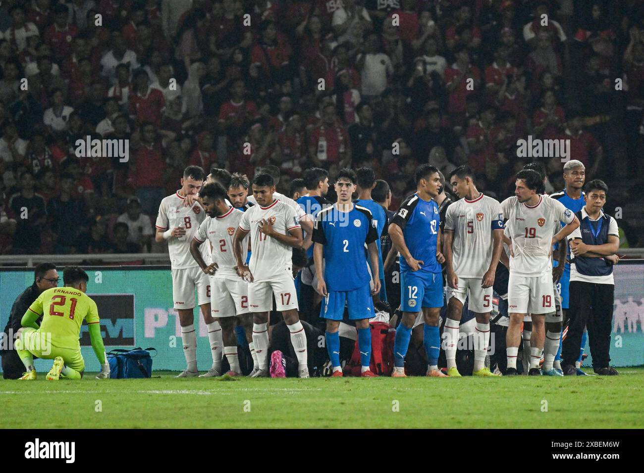 Jakarta, Indonesia. 11th June, 2024. Players make a circle as medical ...