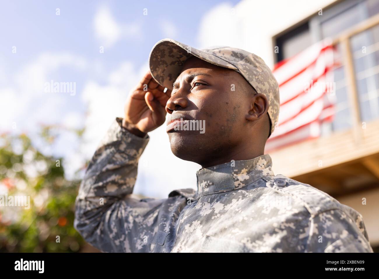 African American young soldier in military uniform saluting. American ...