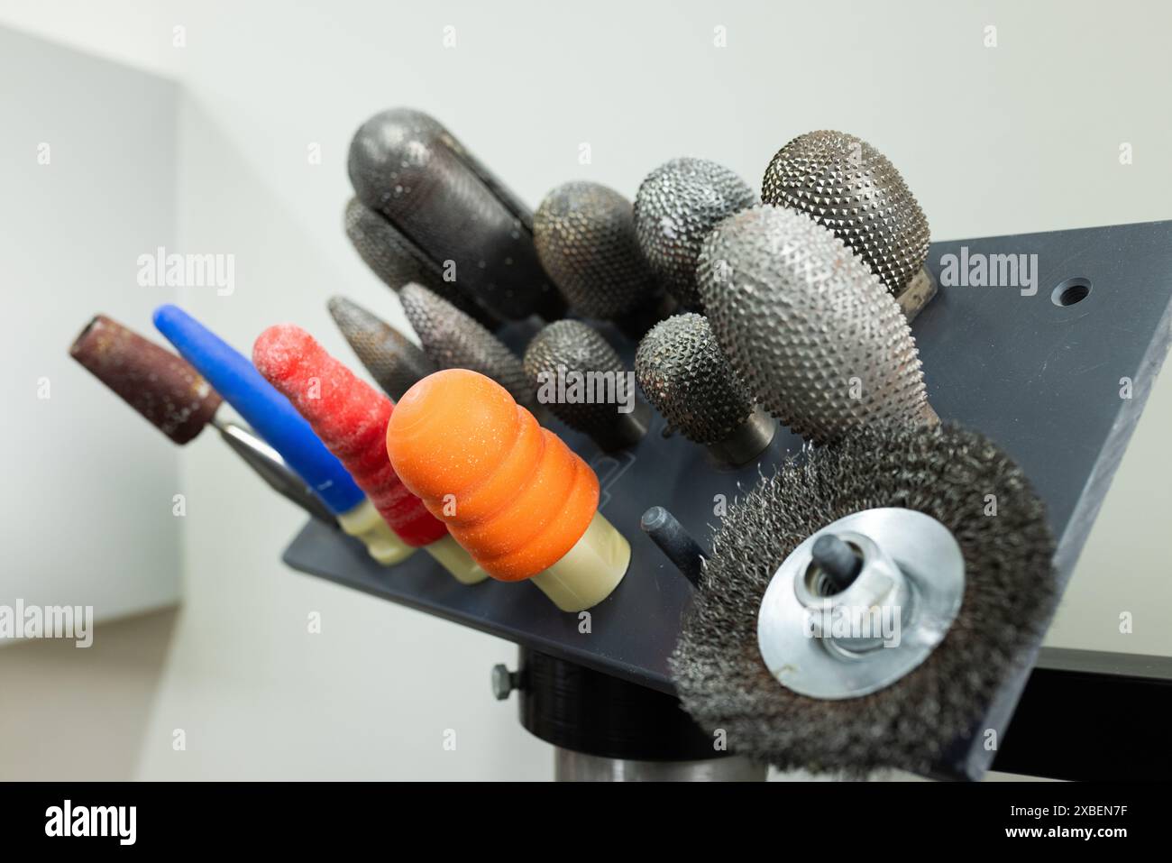 Various prosthetic tools organized on stand in a lab. The white ...