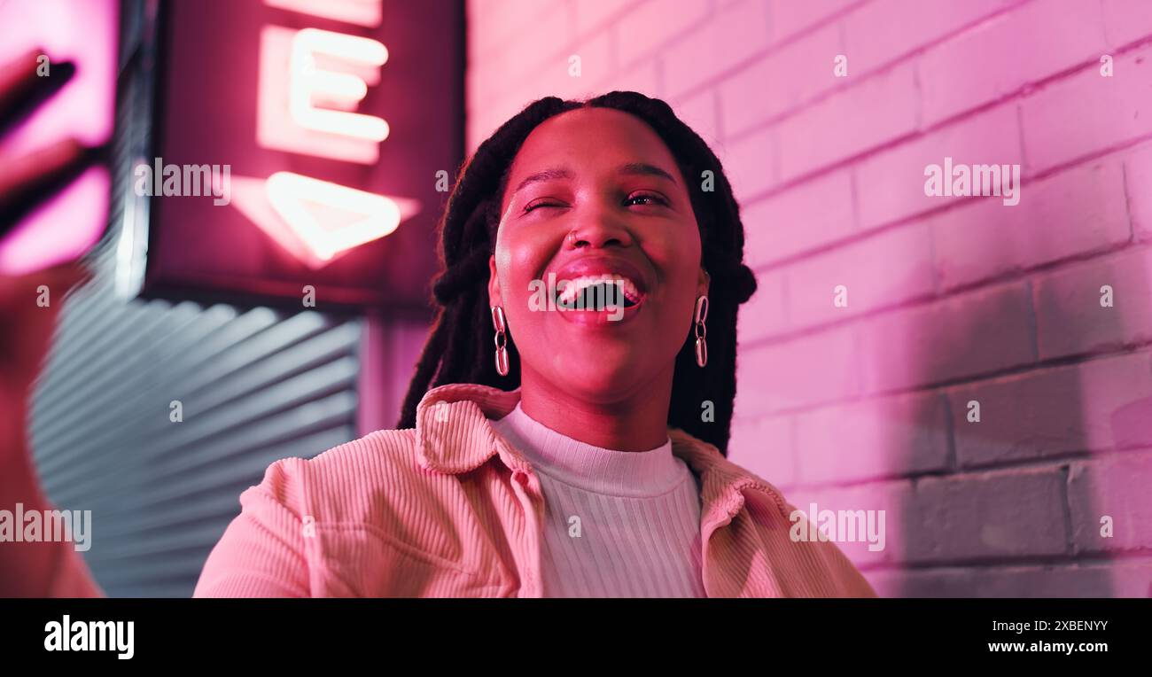 Happy woman, laughing and video call with phone for funny joke, meme or ...