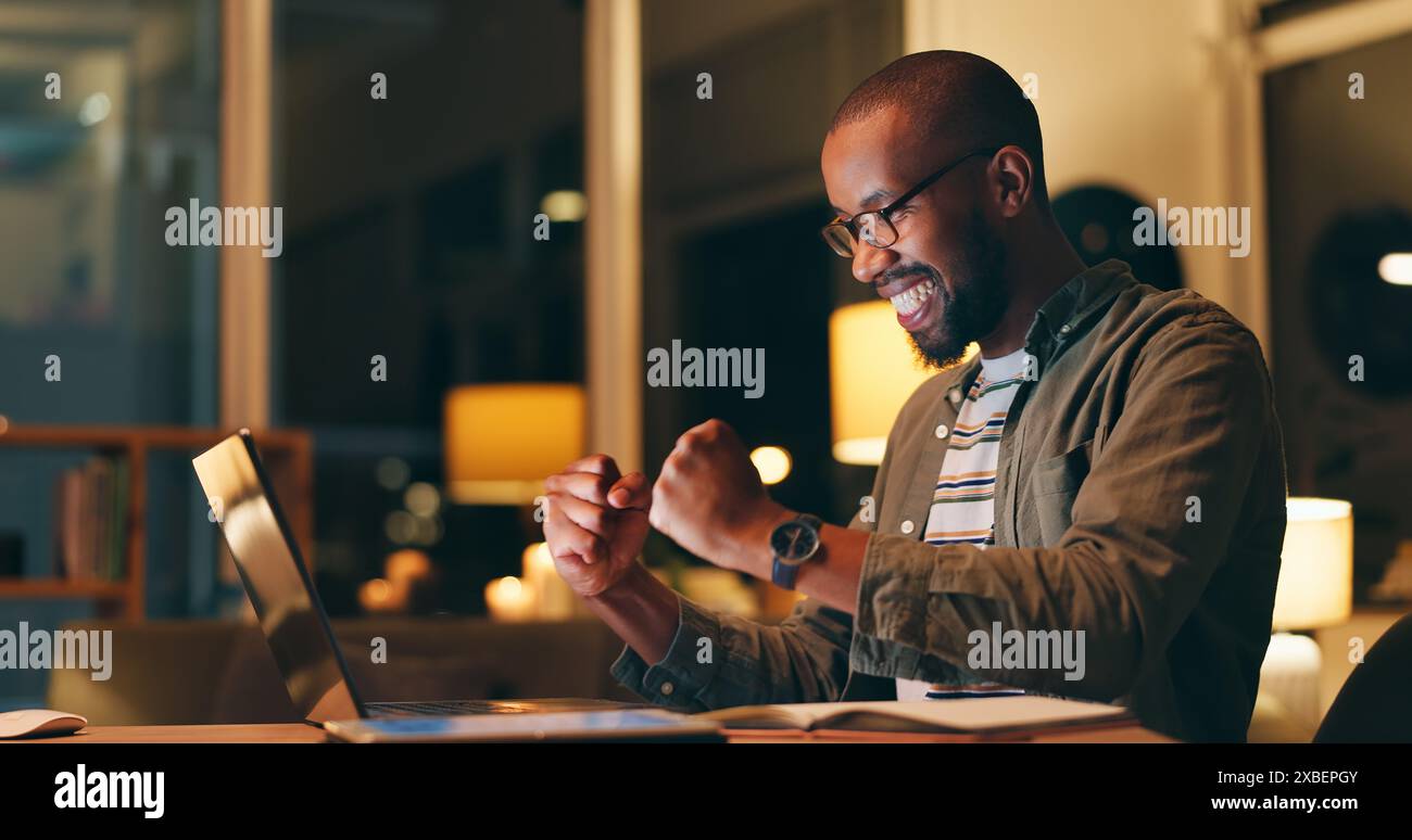 Happy, black man and night with laptop in celebration for winning ...
