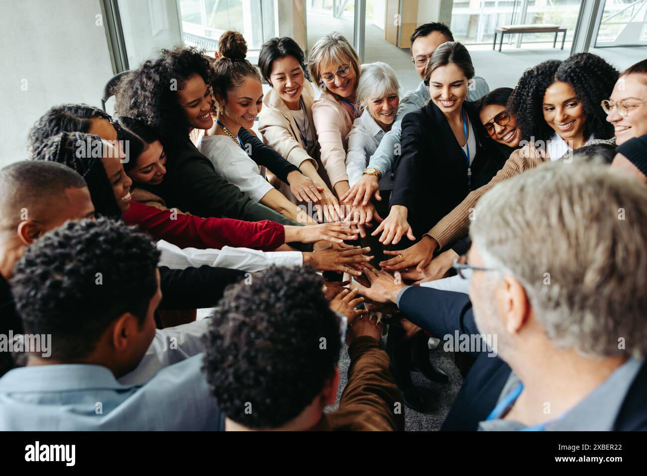 Diverse team demonstrating teamwork and inclusion at a conference, focusing on unity and ...
