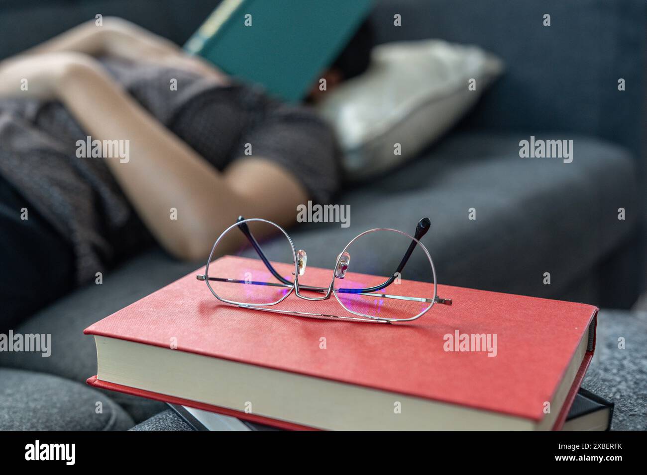 Woman book sleeping on a couch hi-res stock photography and images - Alamy