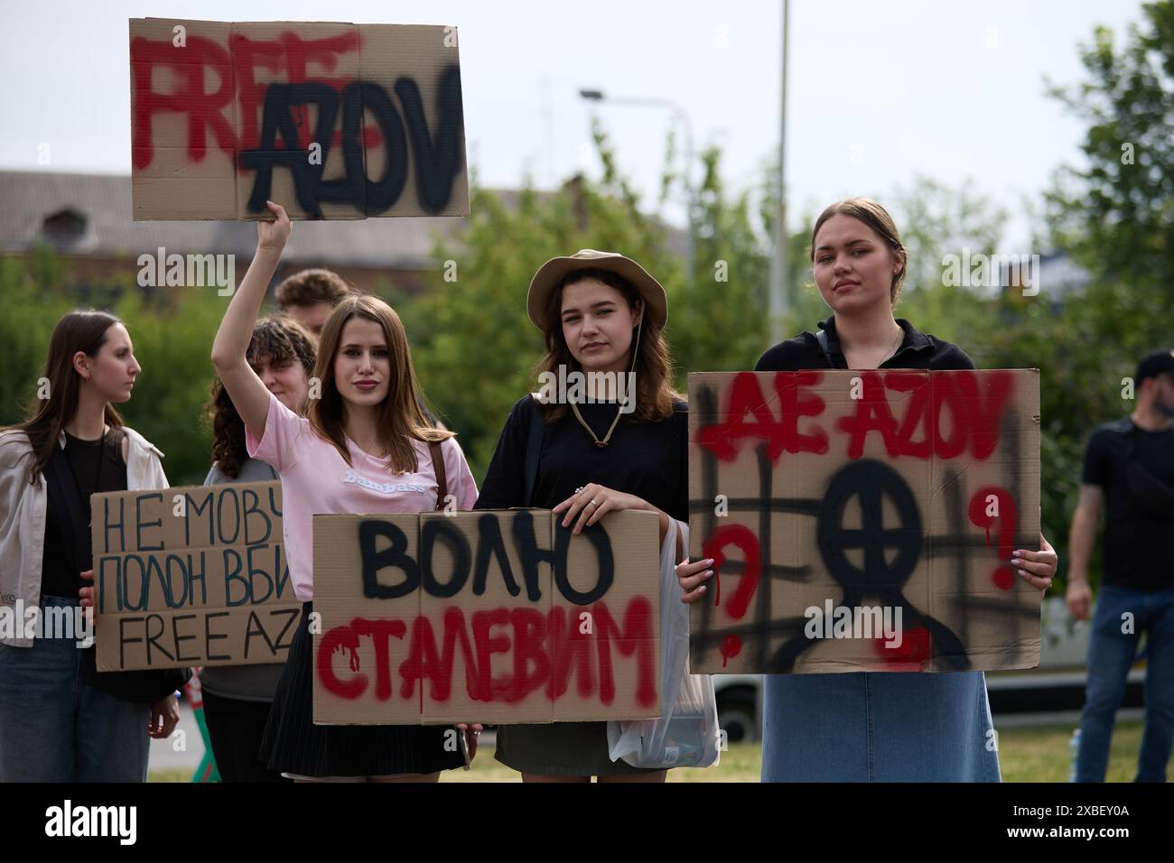 Young Ukrainian girls posing with banners "Free Azov" and "Freedom To ...
