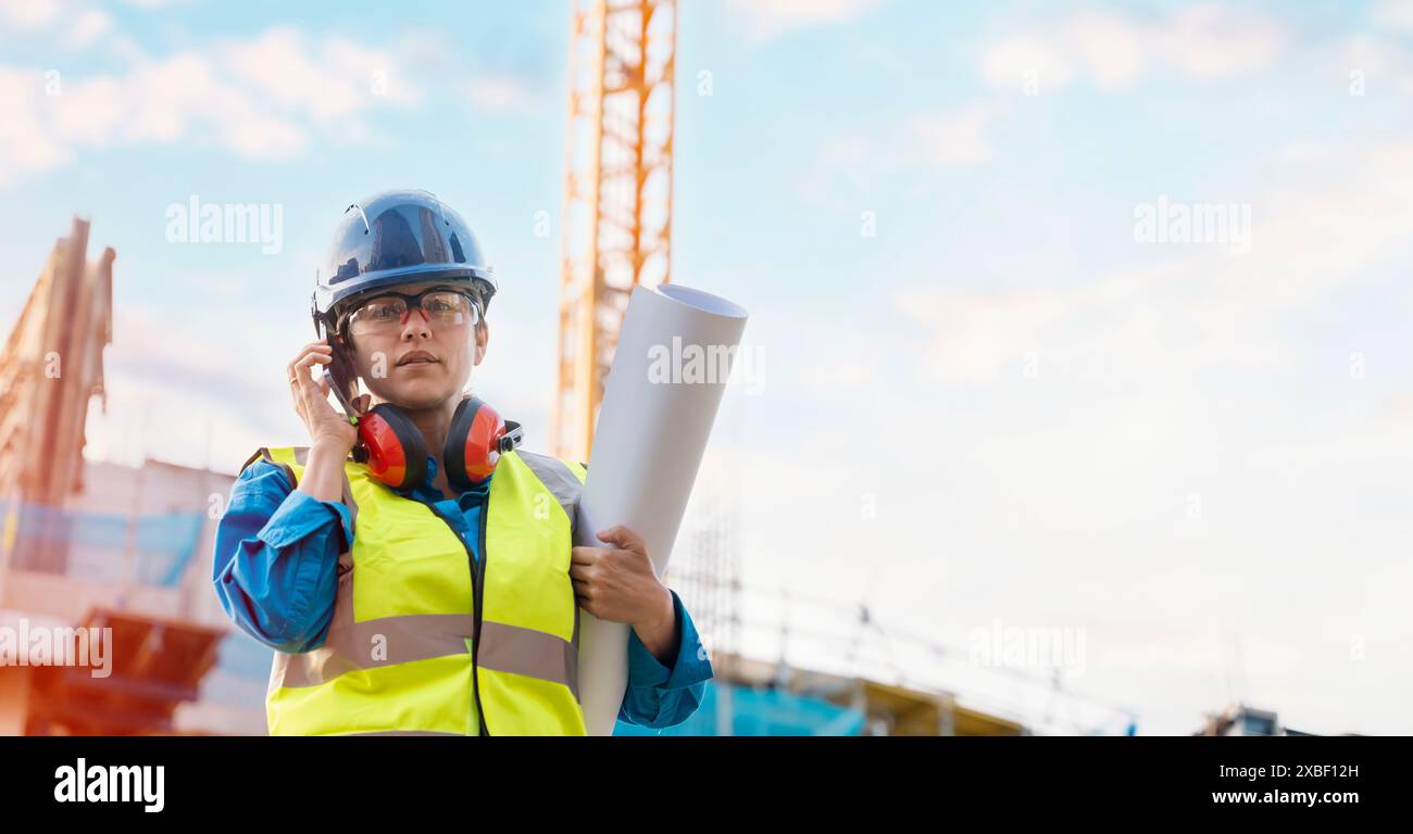 Female site engineer surveyor working with theodolite total station EDM ...