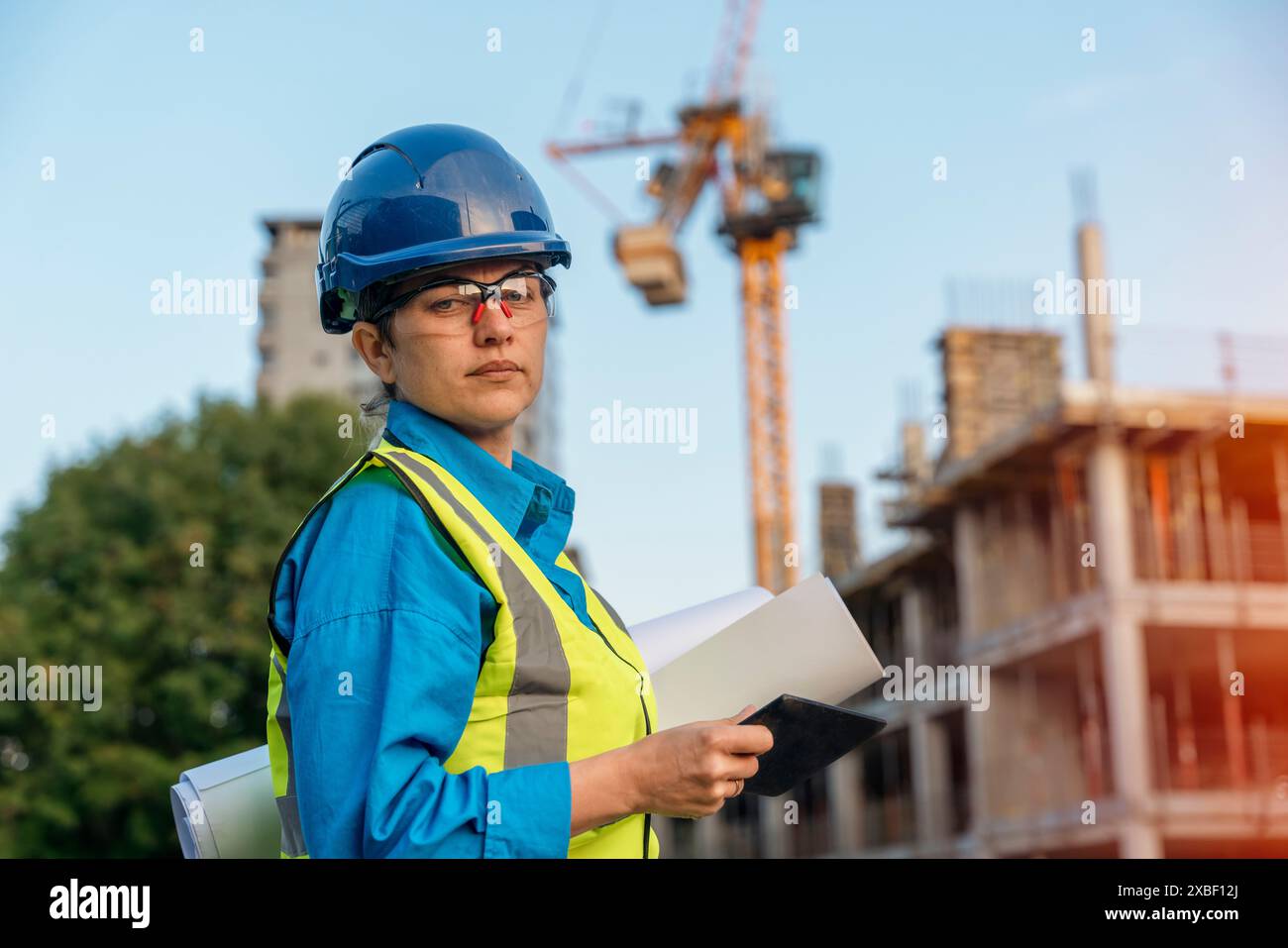 Female site engineer surveyor working with theodolite total station EDM ...