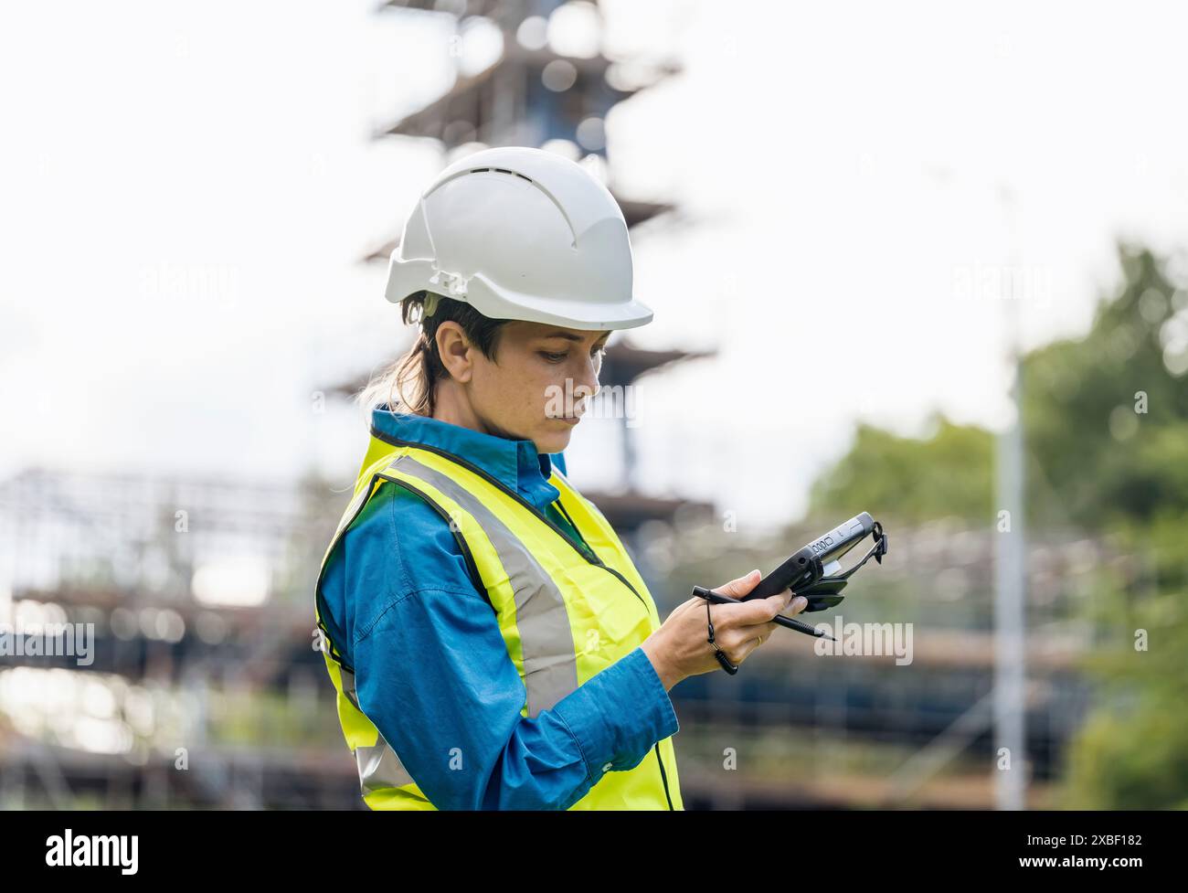 Female site engineer surveyor working with theodolite total station EDM ...
