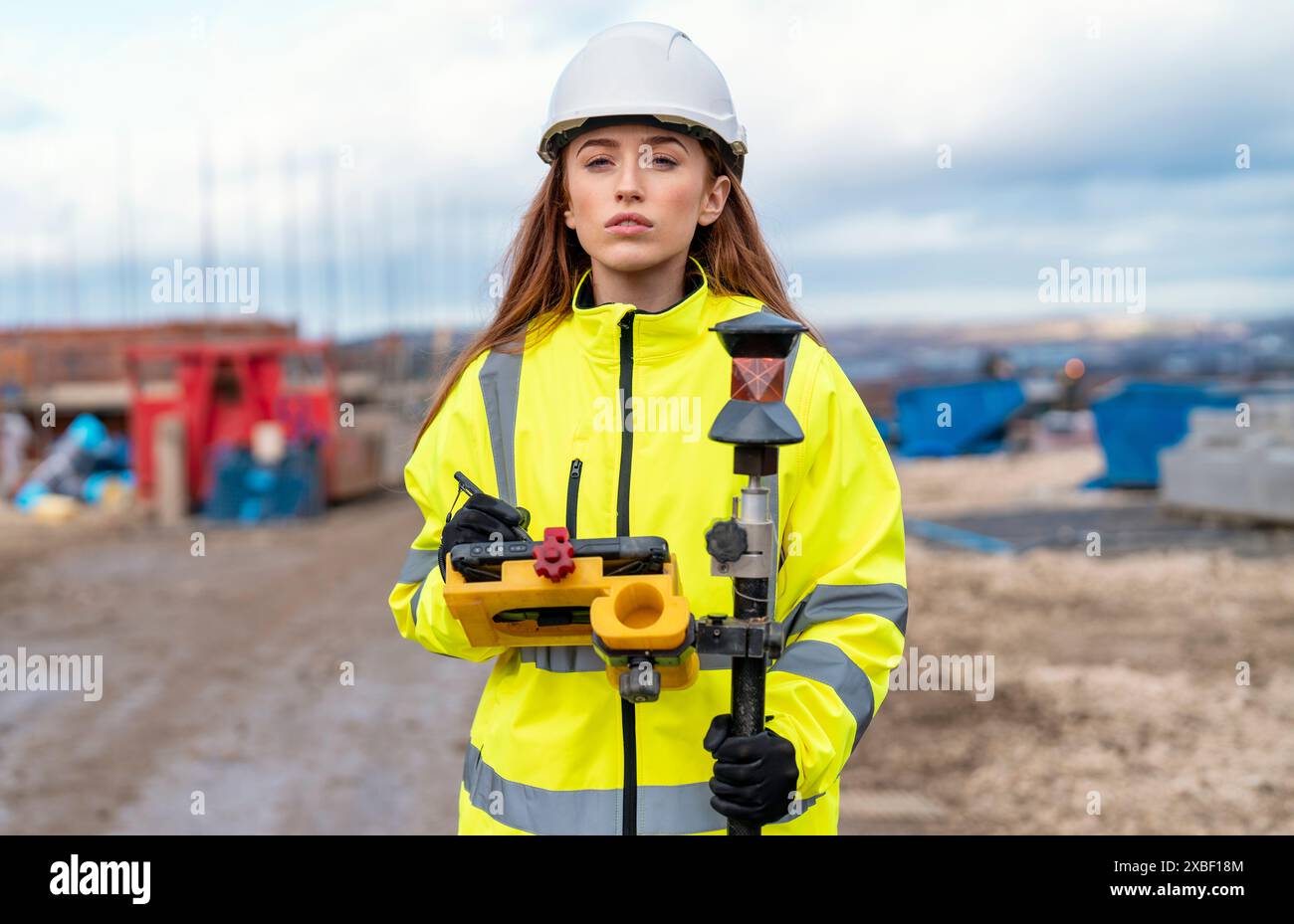Female site engineer surveyor working with theodolite total station EDM ...