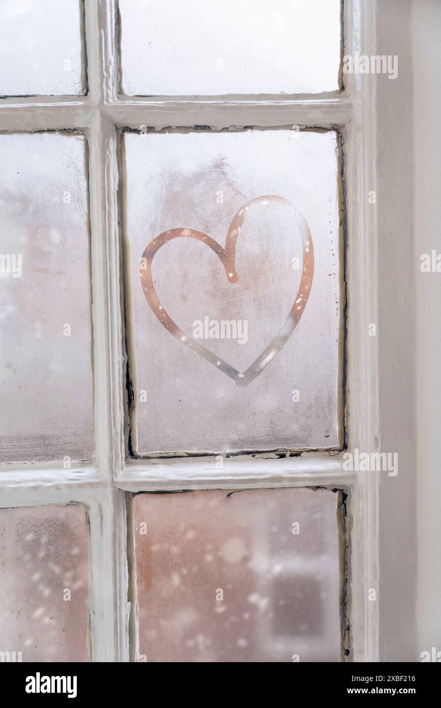 Heart symbol on frozen window hi-res stock photography and images - Alamy