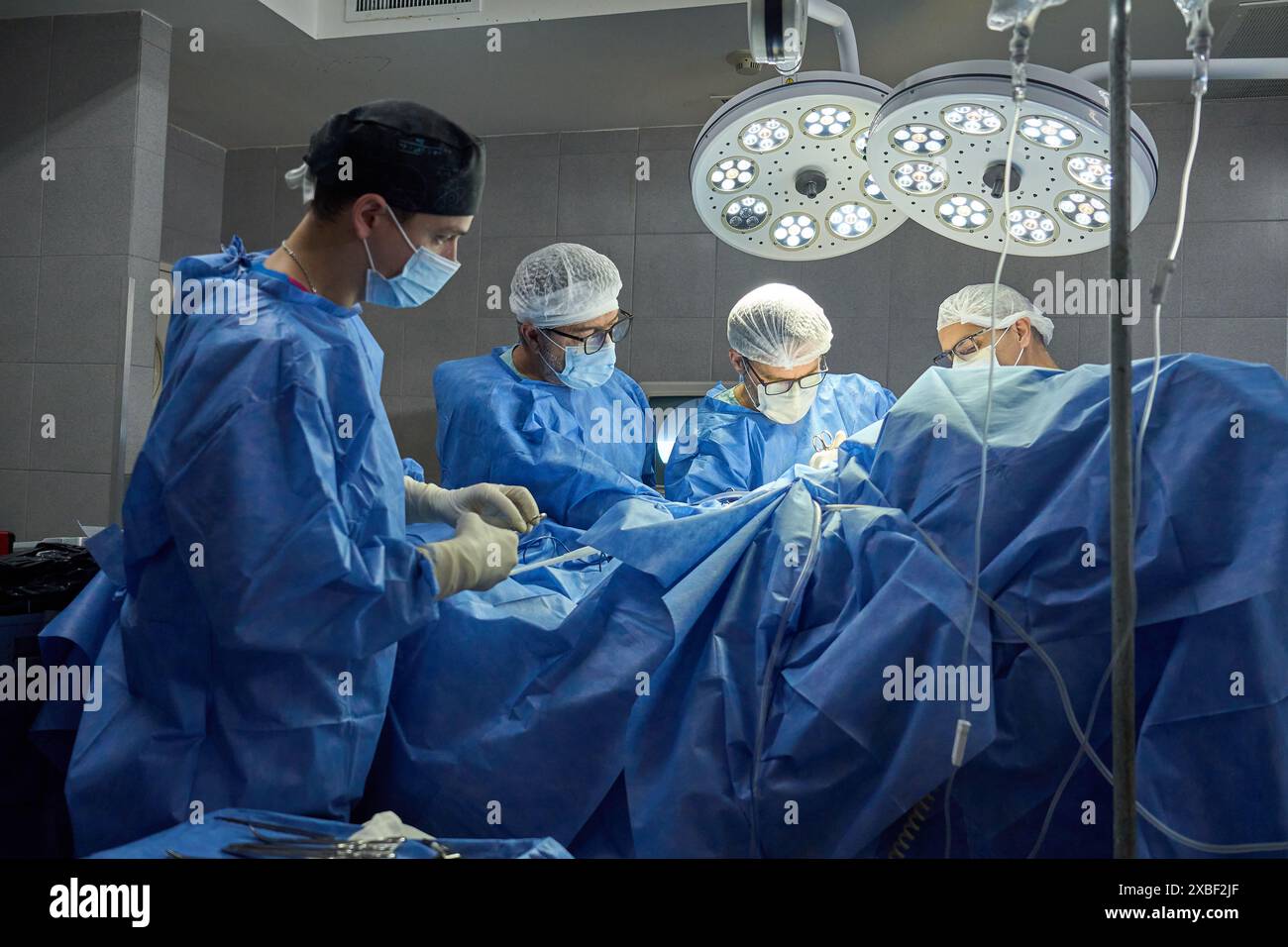 Surgical Team Performing Procedure in Operating Room Stock Photo - Alamy