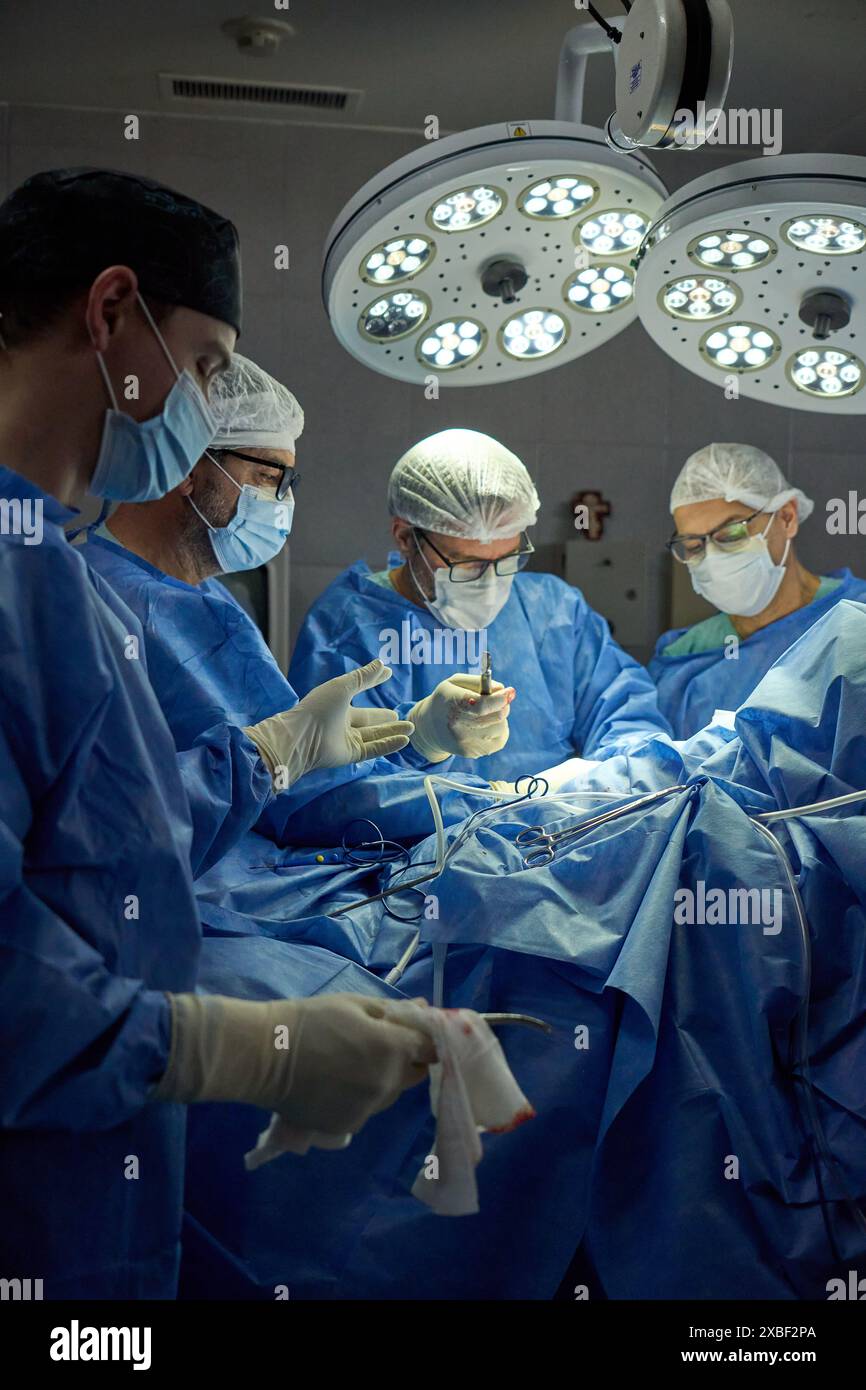 Medical staff performing a critical surgical procedure Stock Photo - Alamy