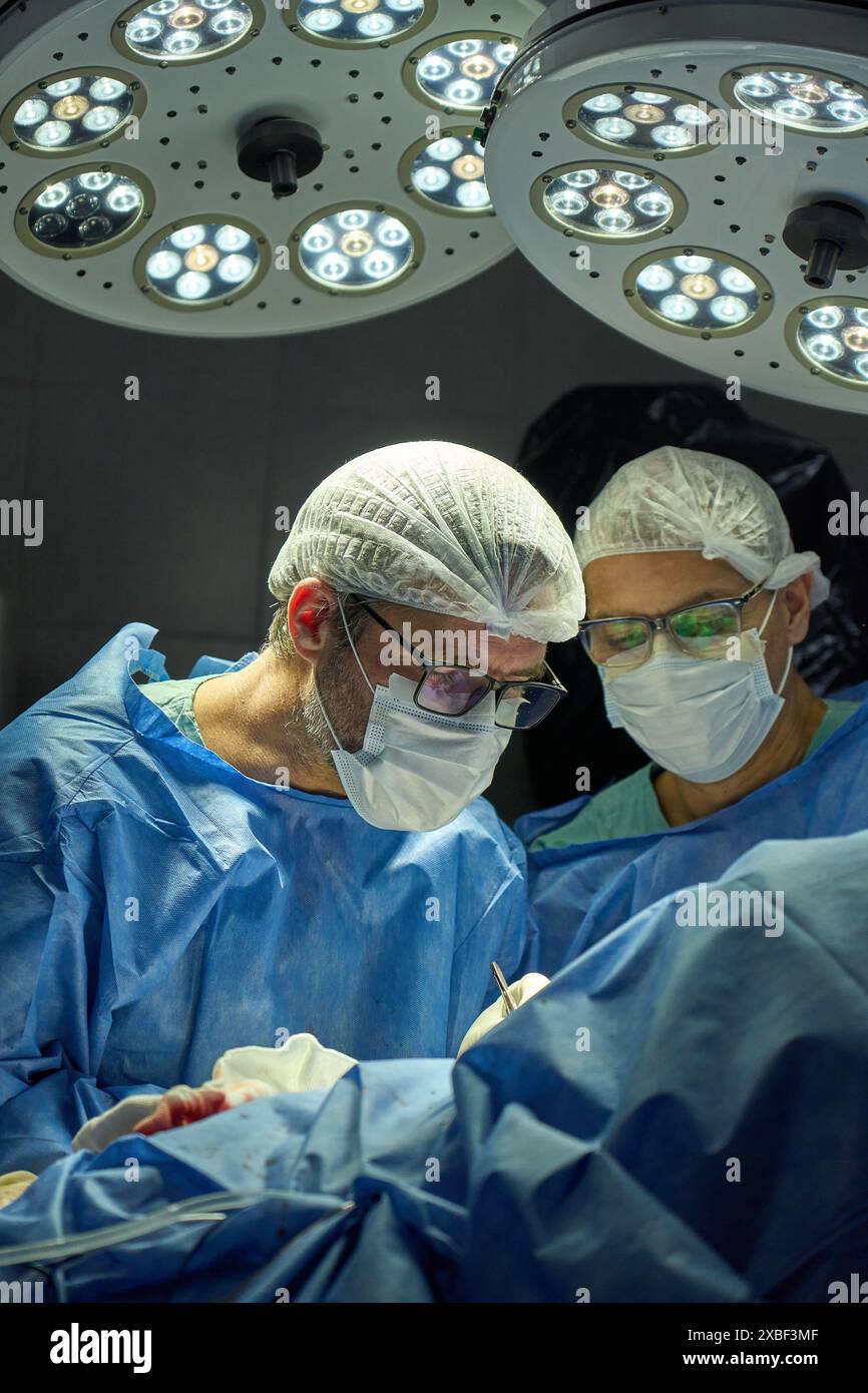 Medical professionals conducting a complex surgery Stock Photo - Alamy