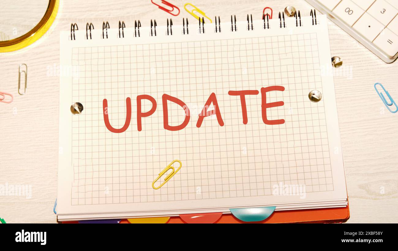 Business concept. UPDATE text in a notebook on the desk of a ...