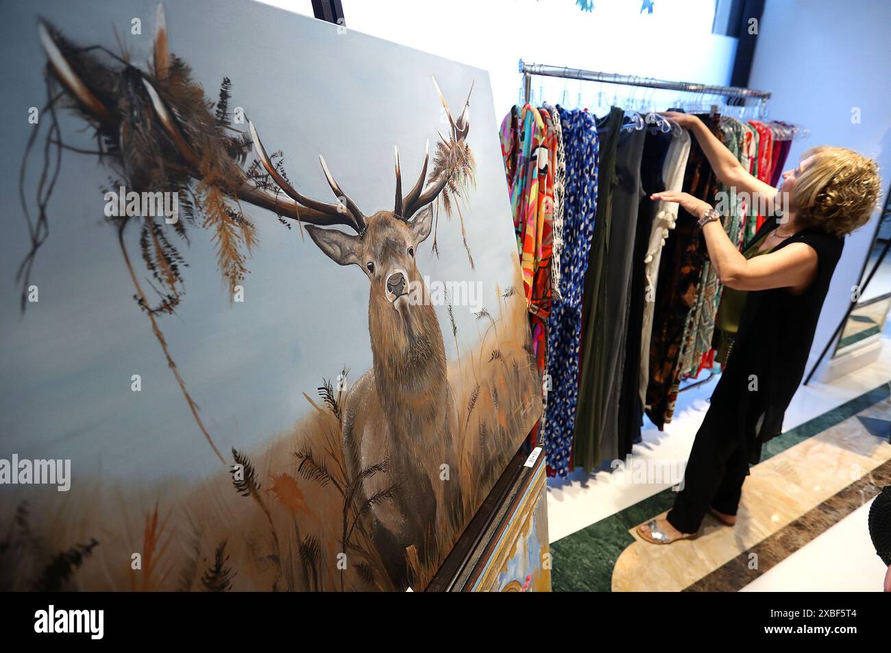 Beirut, Lebanon. 11th June, 2024. An exhibitor arranges exhibits at the ...