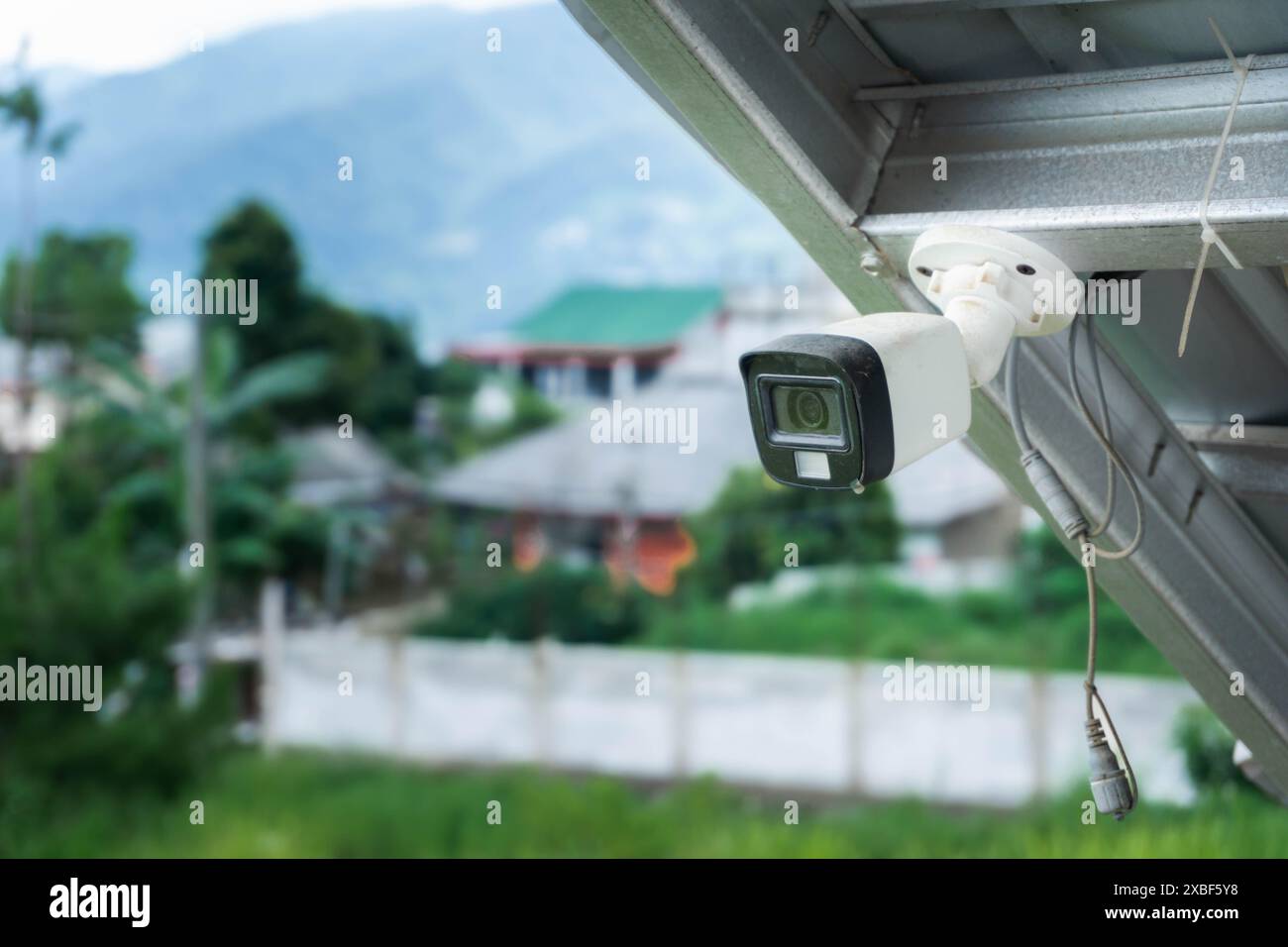 dusty security CCTV camera monitoring system with panoramic view of a ...