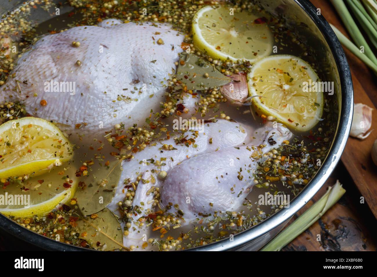 Chicken soaked in salt water brine with lemon, herb and spice Stock ...