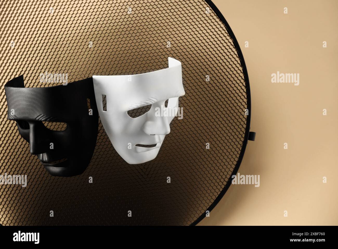 Theater arts. Two masks and honeycomb grid on beige background, top ...
